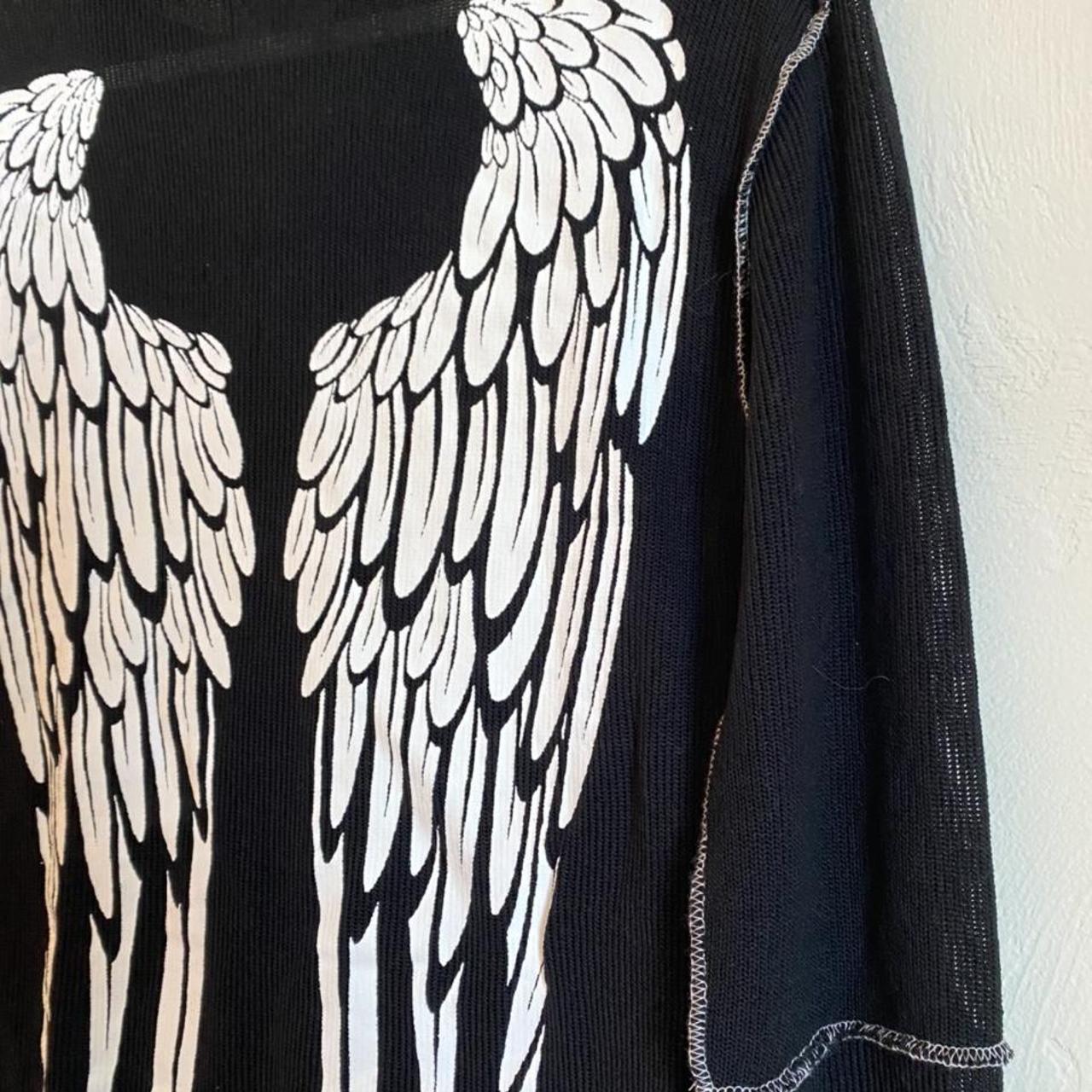Super sick black knit top with wing graphics on the... - Depop