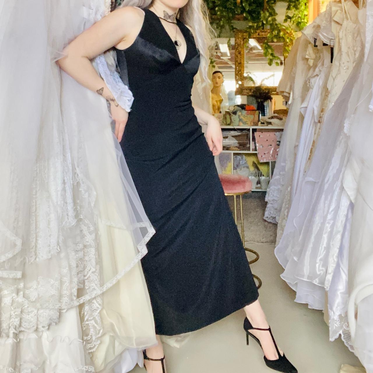 Sexy black body-con dress with a low V-neckline. A... - Depop