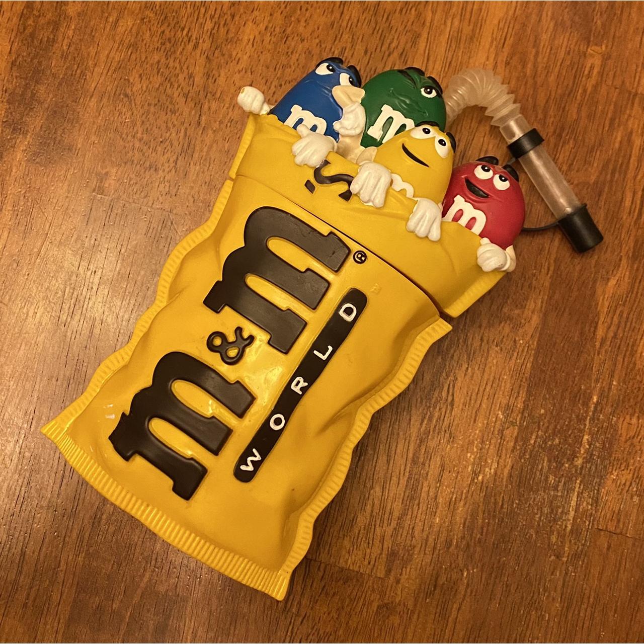 Yellow M&M’s world candy bag shaped drinking... | Depop