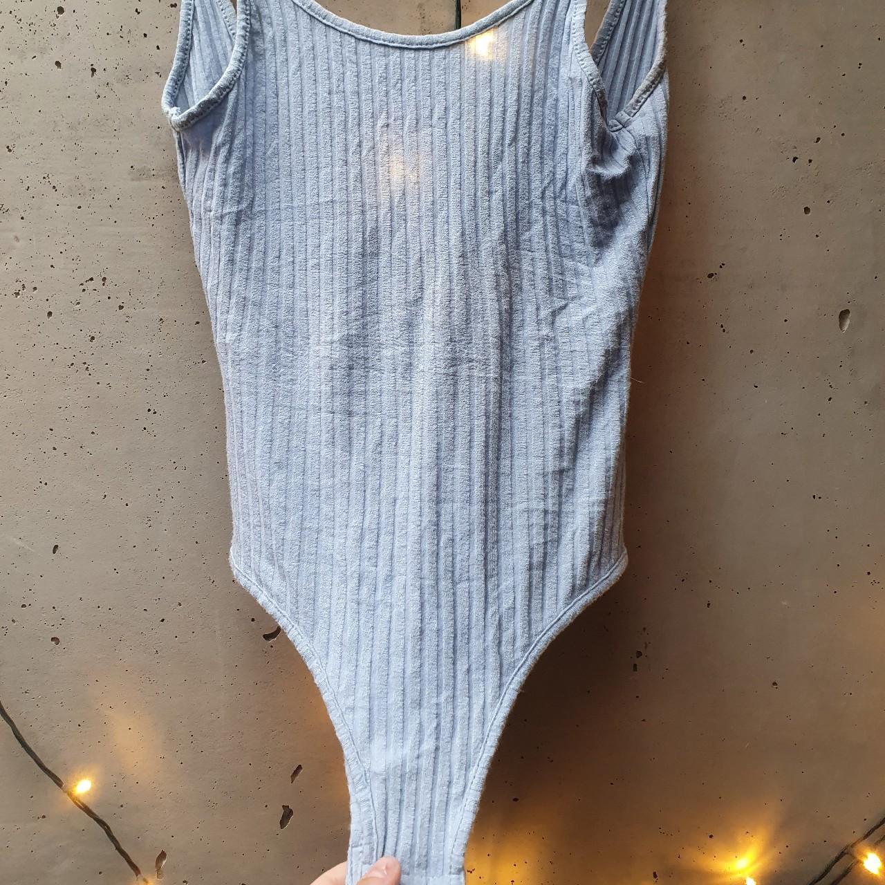 Baby blue ribbed strappy bodysuit from Urban... - Depop