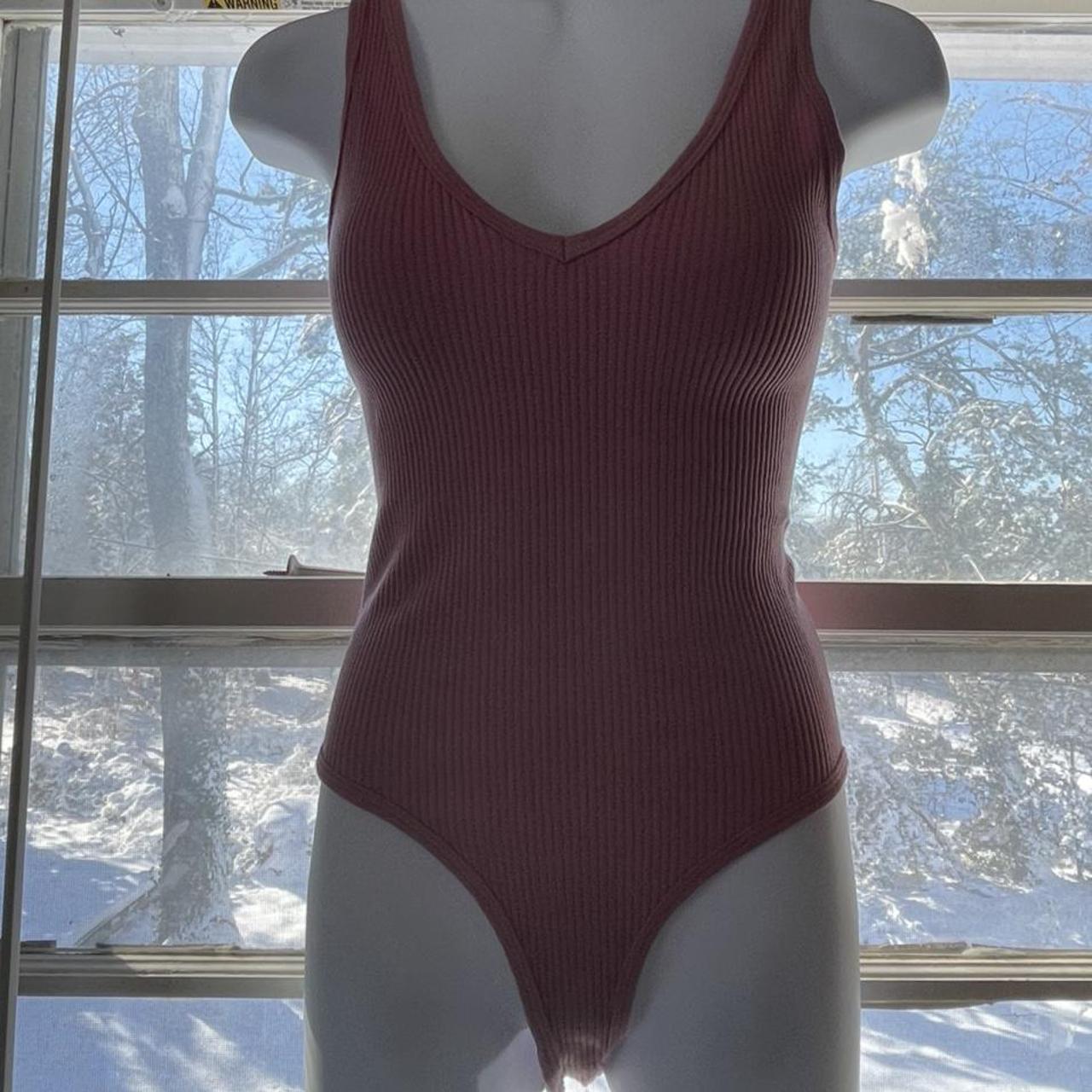 Pink one piece, size small. Stretchy and soft... - Depop