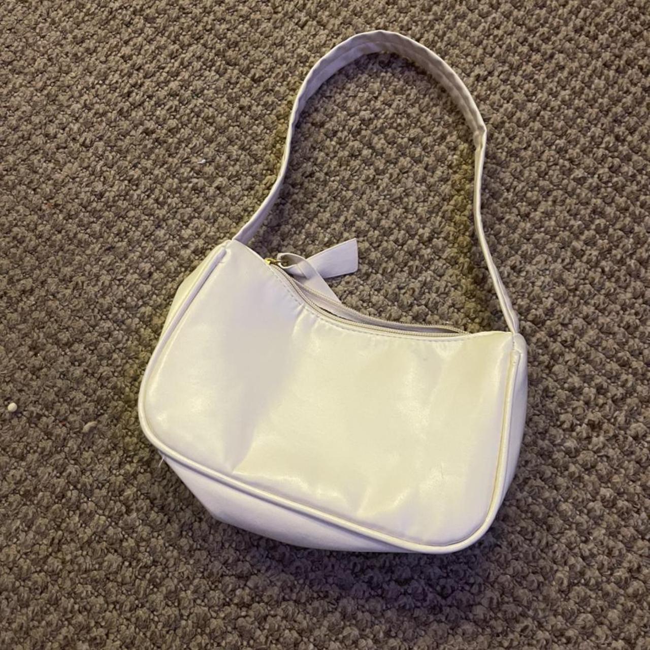 A cute little white handbag. Very handy for a night... - Depop