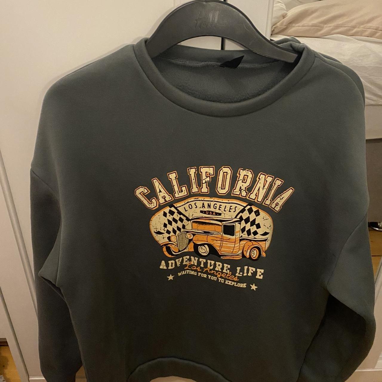 woman’s grey graphic design jumper from shein in... - Depop