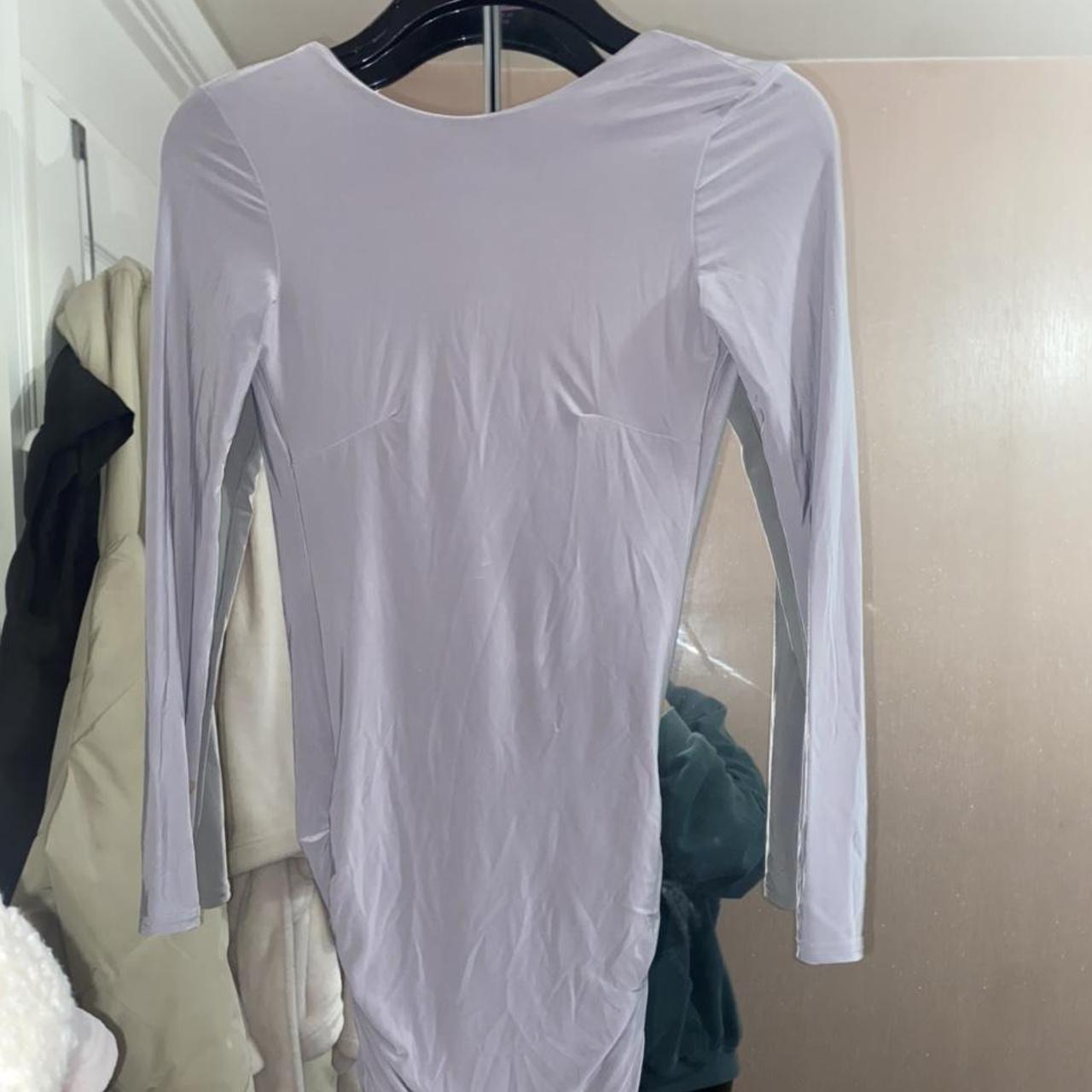 Grey slinky backless mini dress. Only worn once. Size 6 - Depop