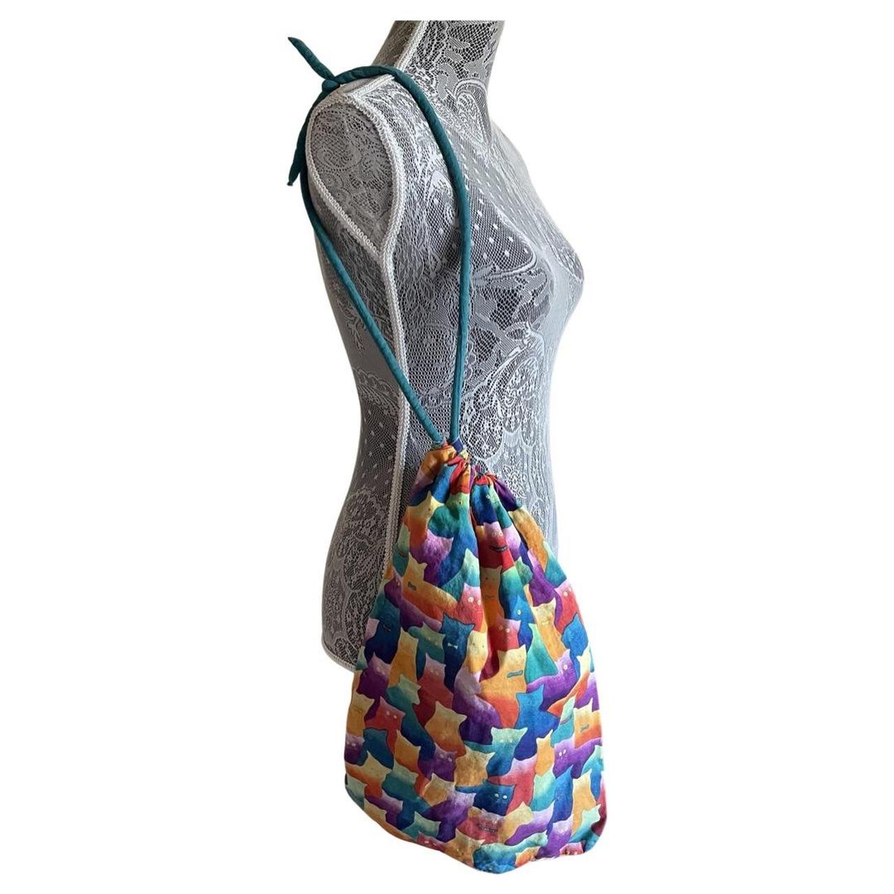 Handmade Fabric Drawstring Bag featuring a colorful... - Depop