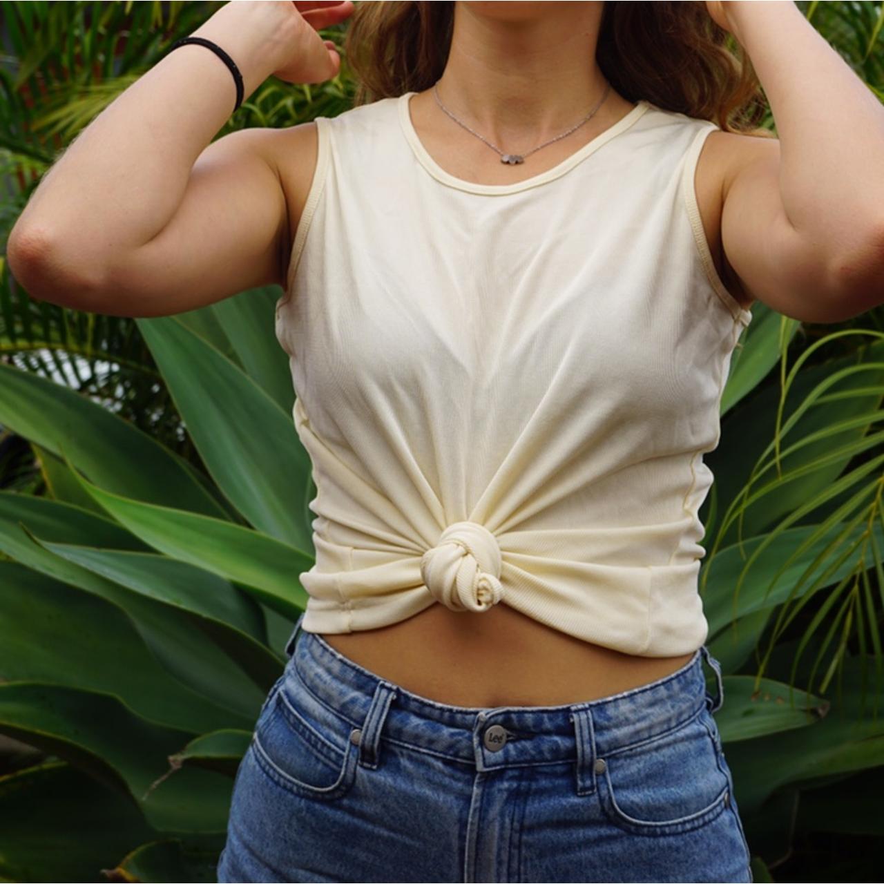 Pastel yellow tank Subtle rib in fabric and very... - Depop