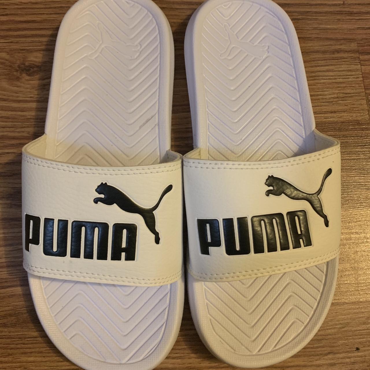 white womans puma slides - Depop