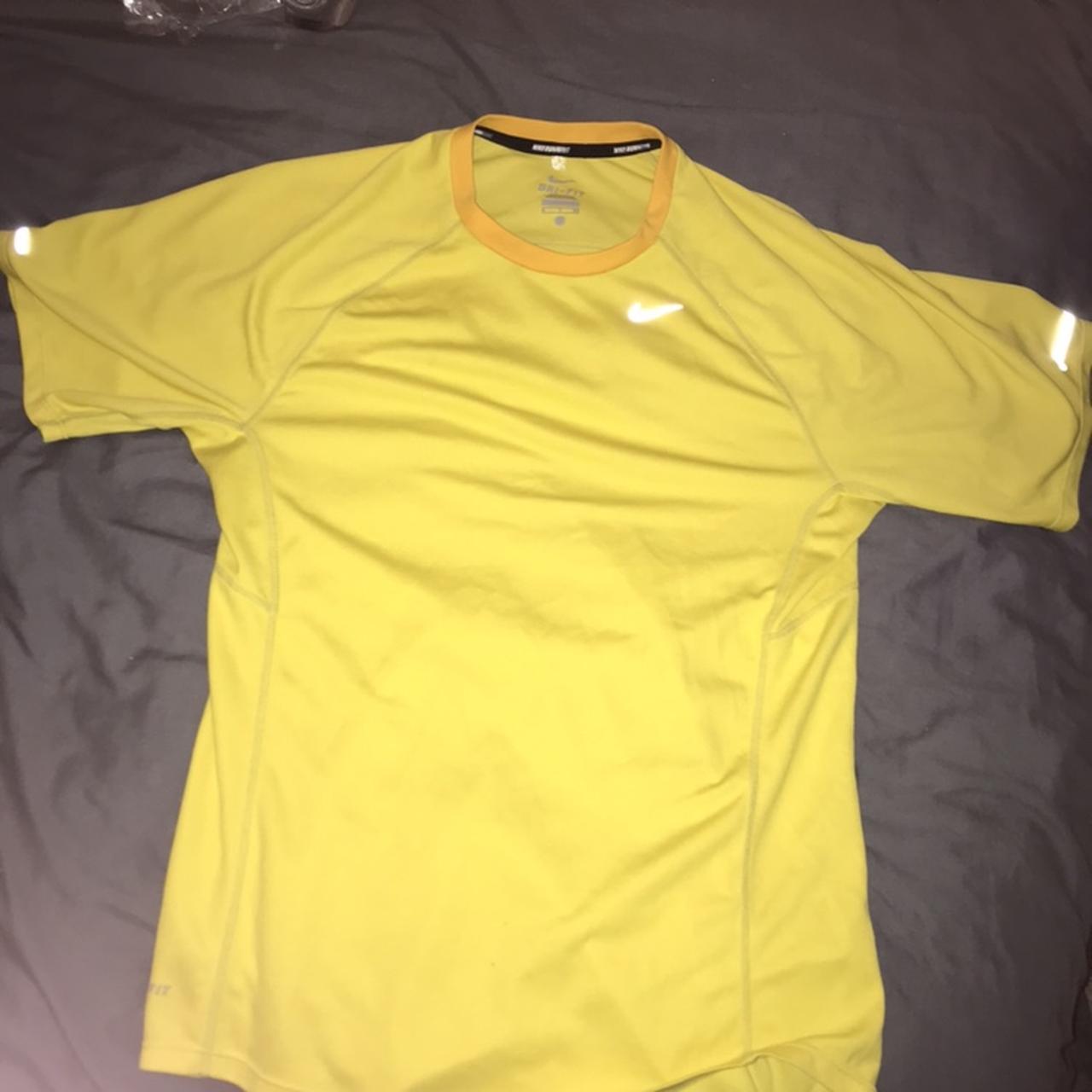 Nike Dri-Fit yellow reflective running top size... - Depop