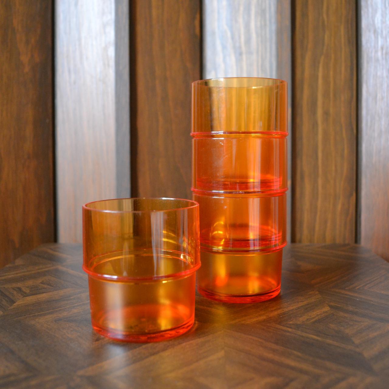 Set of four Tupperware plastic stacking cups. Pure... - Depop