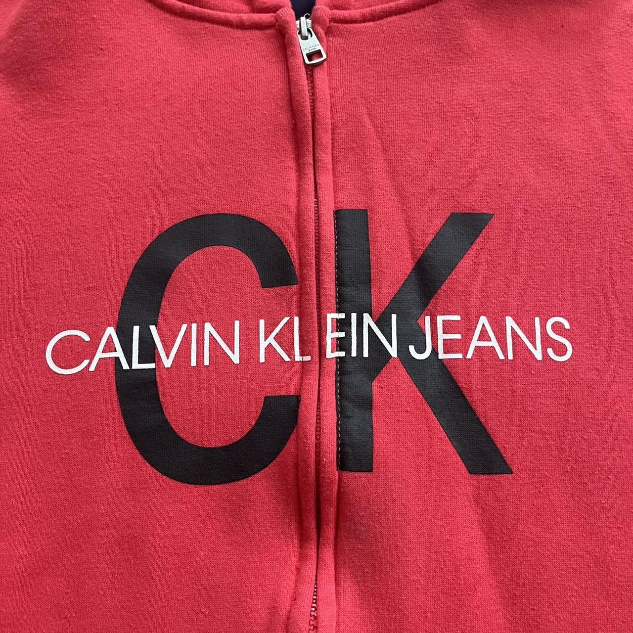 Red Calvin Klein Jeans Graphic Zip Up Hoodie... - Depop