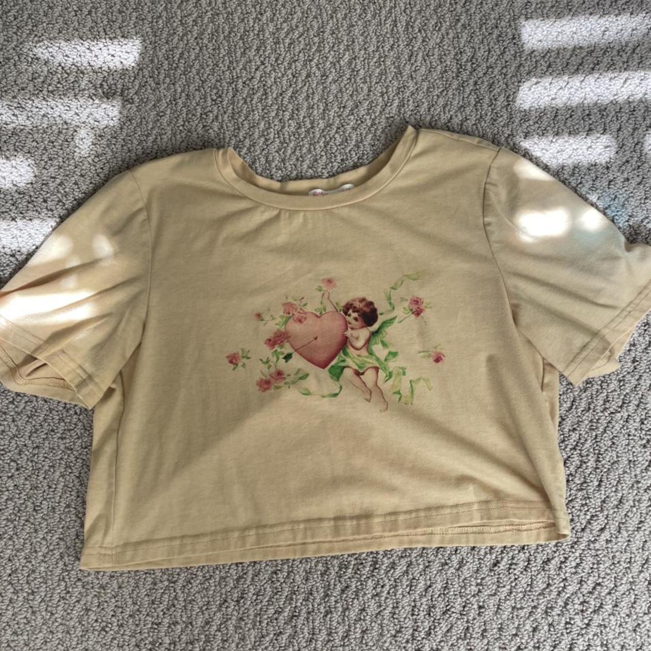 cute angel crop top! worn once color is more... - Depop