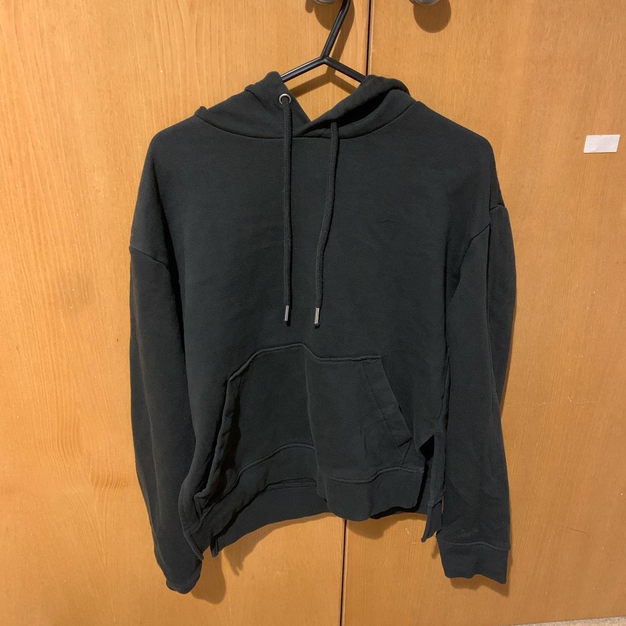 Basic black hoodie with front pocket and slits at... - Depop