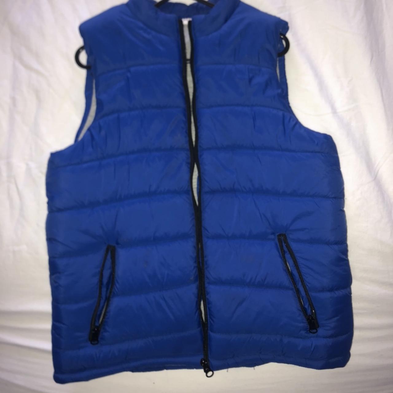 blue puffer vest with pockets and soft cotton... - Depop