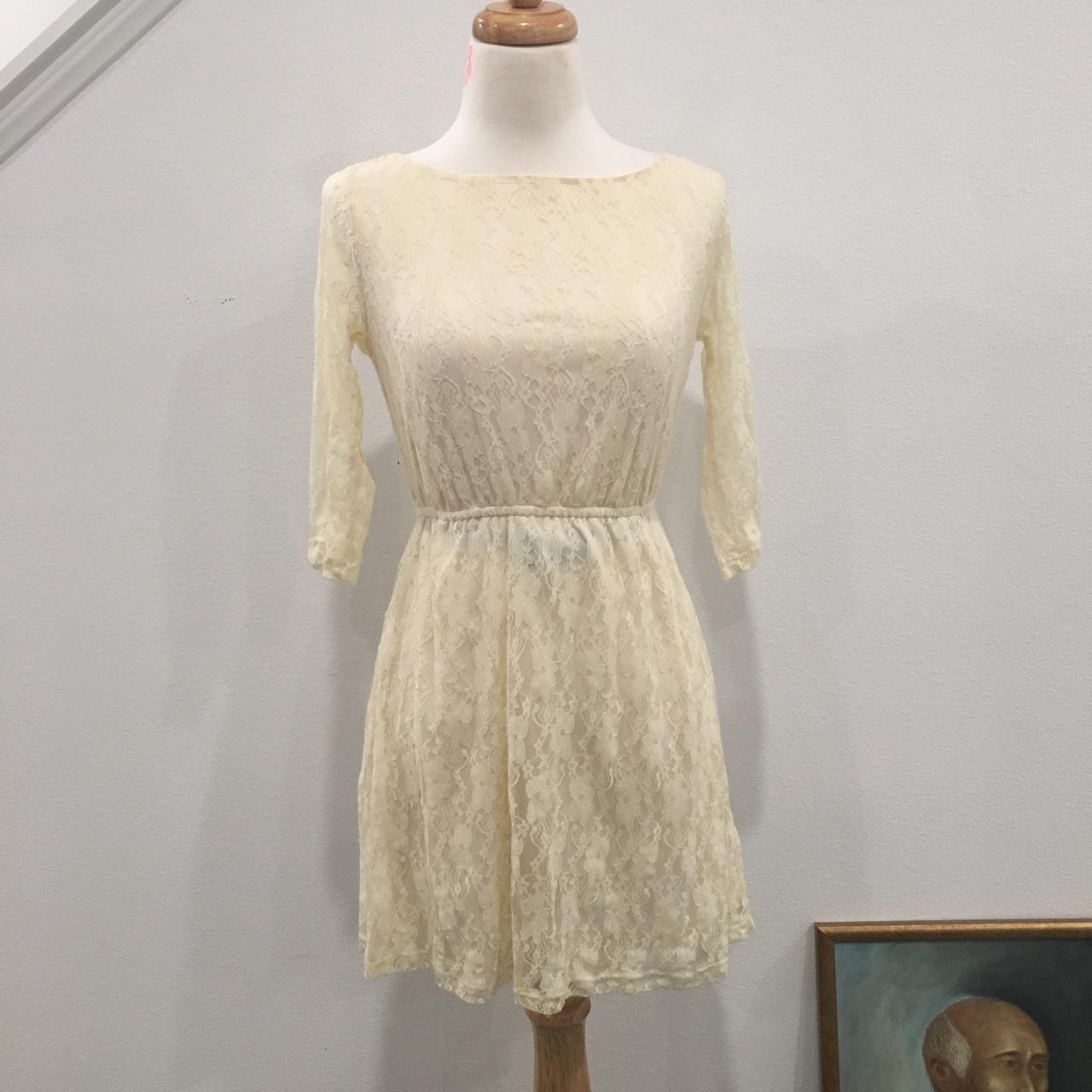 Vintage looking lace dress. Cream color Flirty and... - Depop