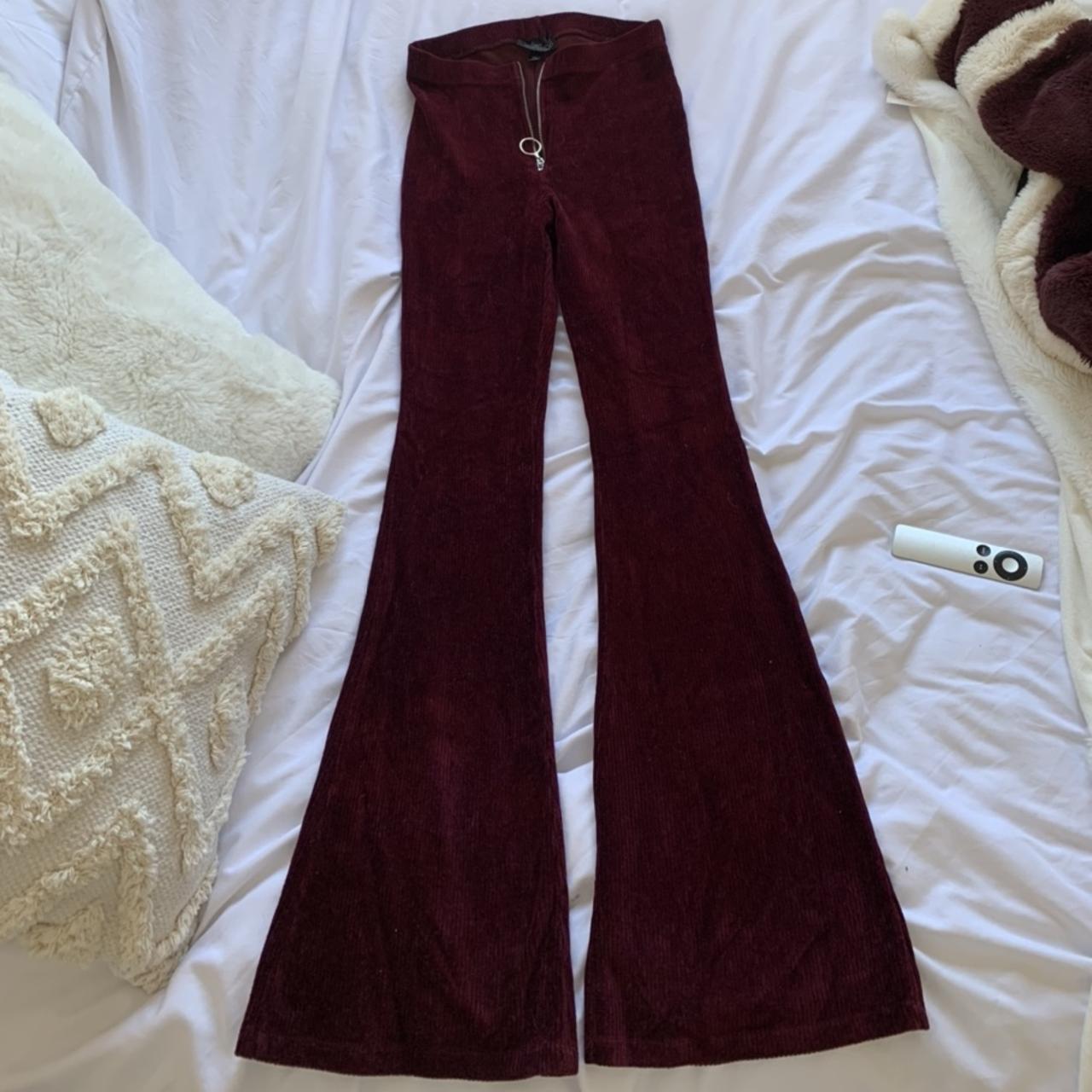 Really cool dark red corduroy flared trousers from... - Depop
