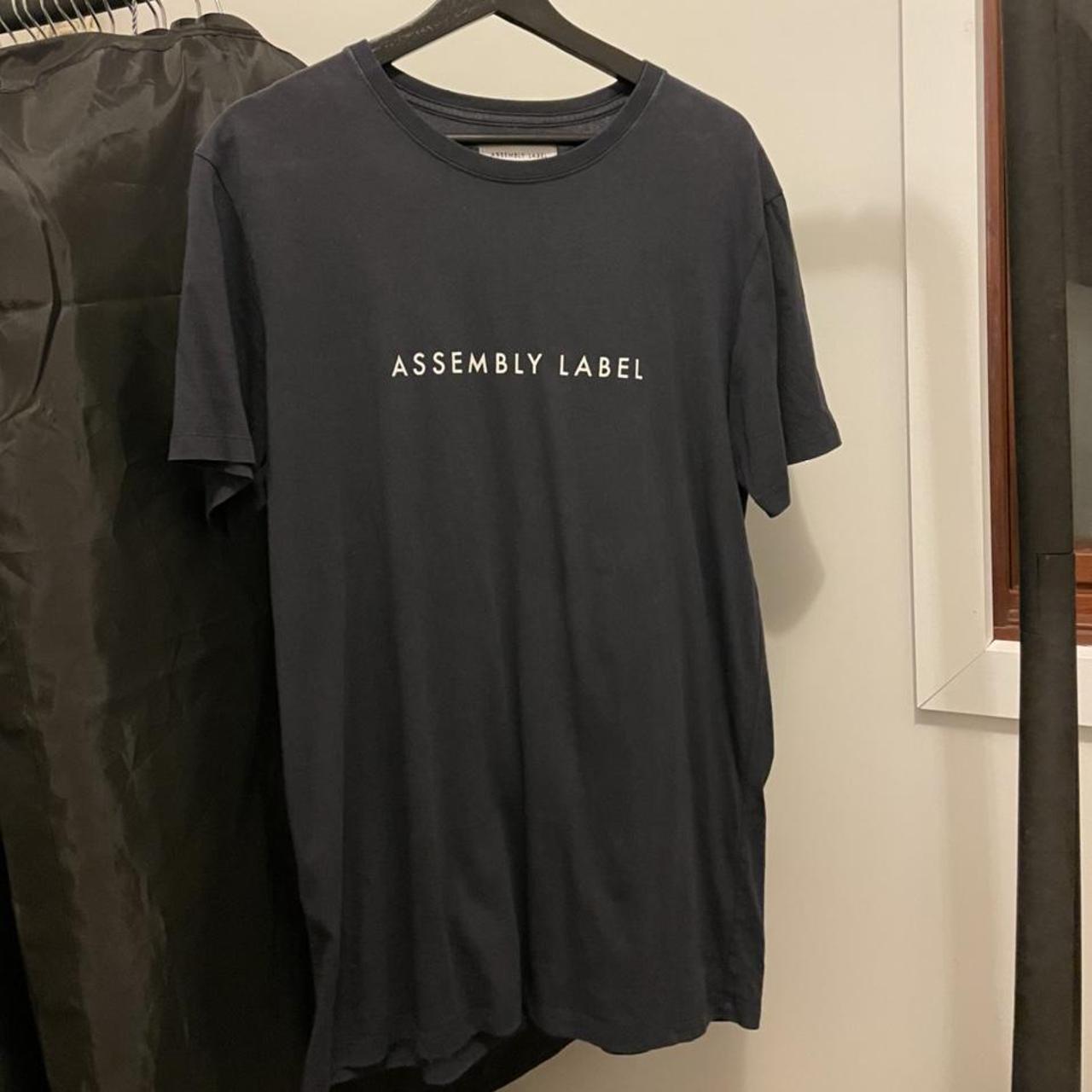 ASSEMBLY LABEL TEE navy tee with logo on front... - Depop