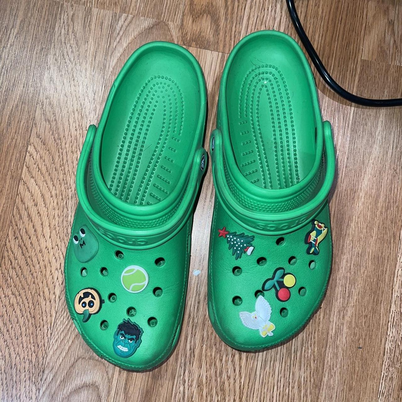 Green crocs with all charms included. Used but good... - Depop
