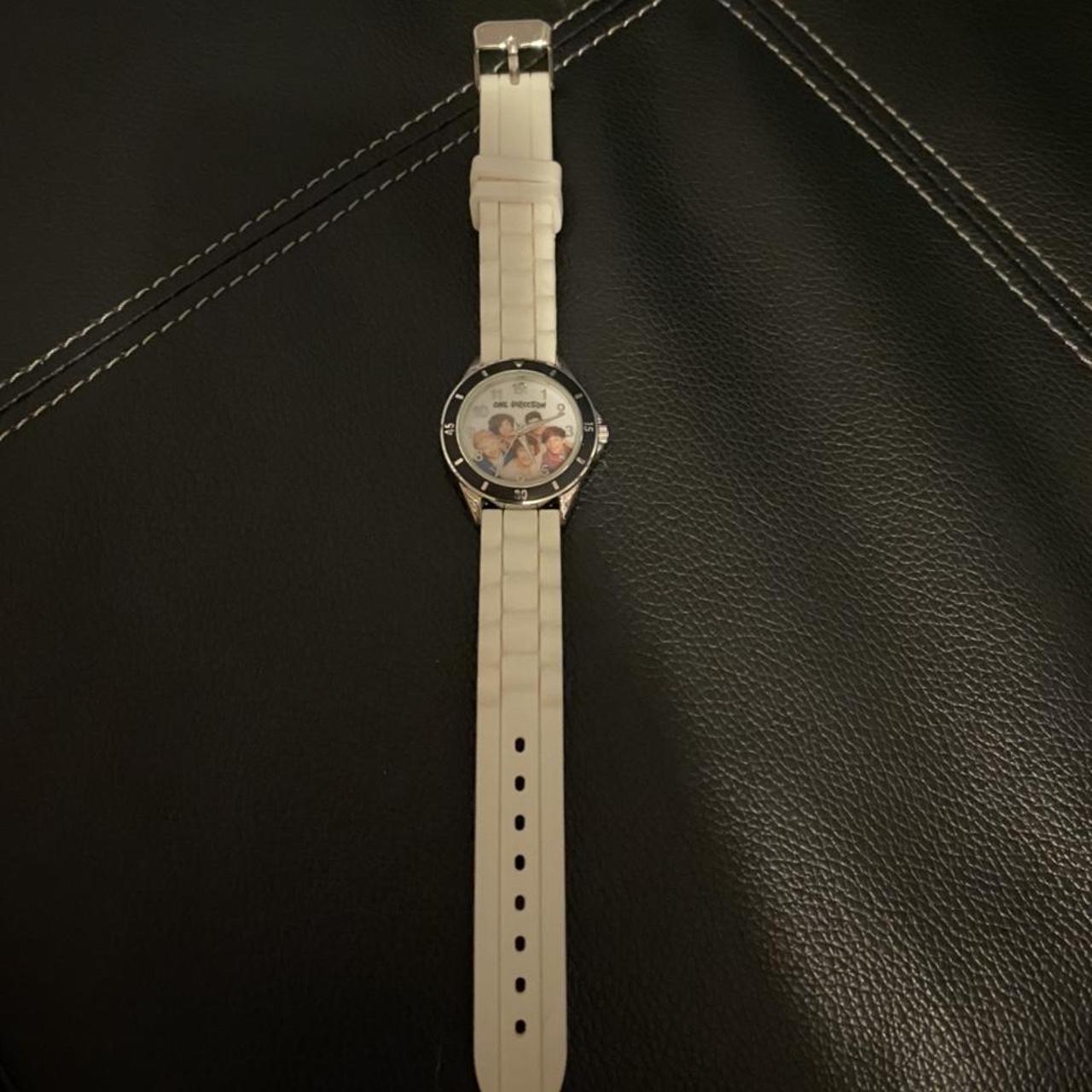 white one direction watch with box, needs new... - Depop