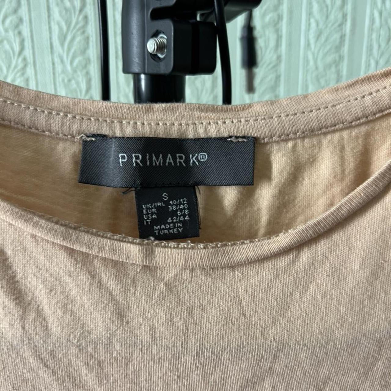 Nude colour top that’s says INDIVIDUAL Top from... - Depop