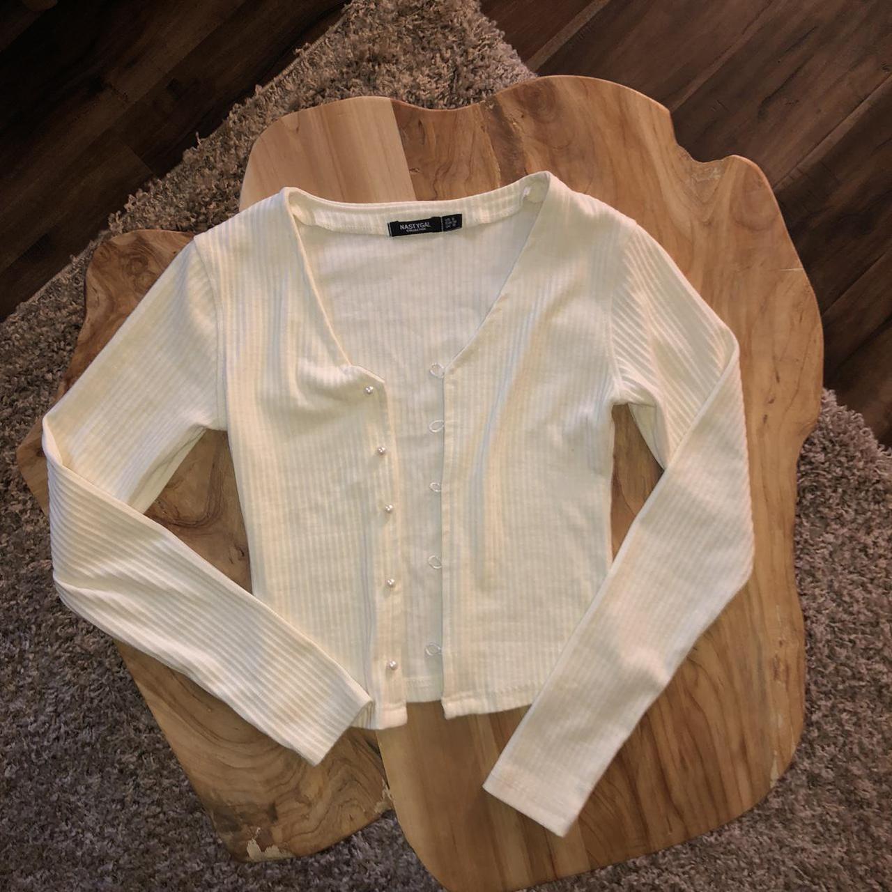 cream colored button up knit top. Pearl button... - Depop