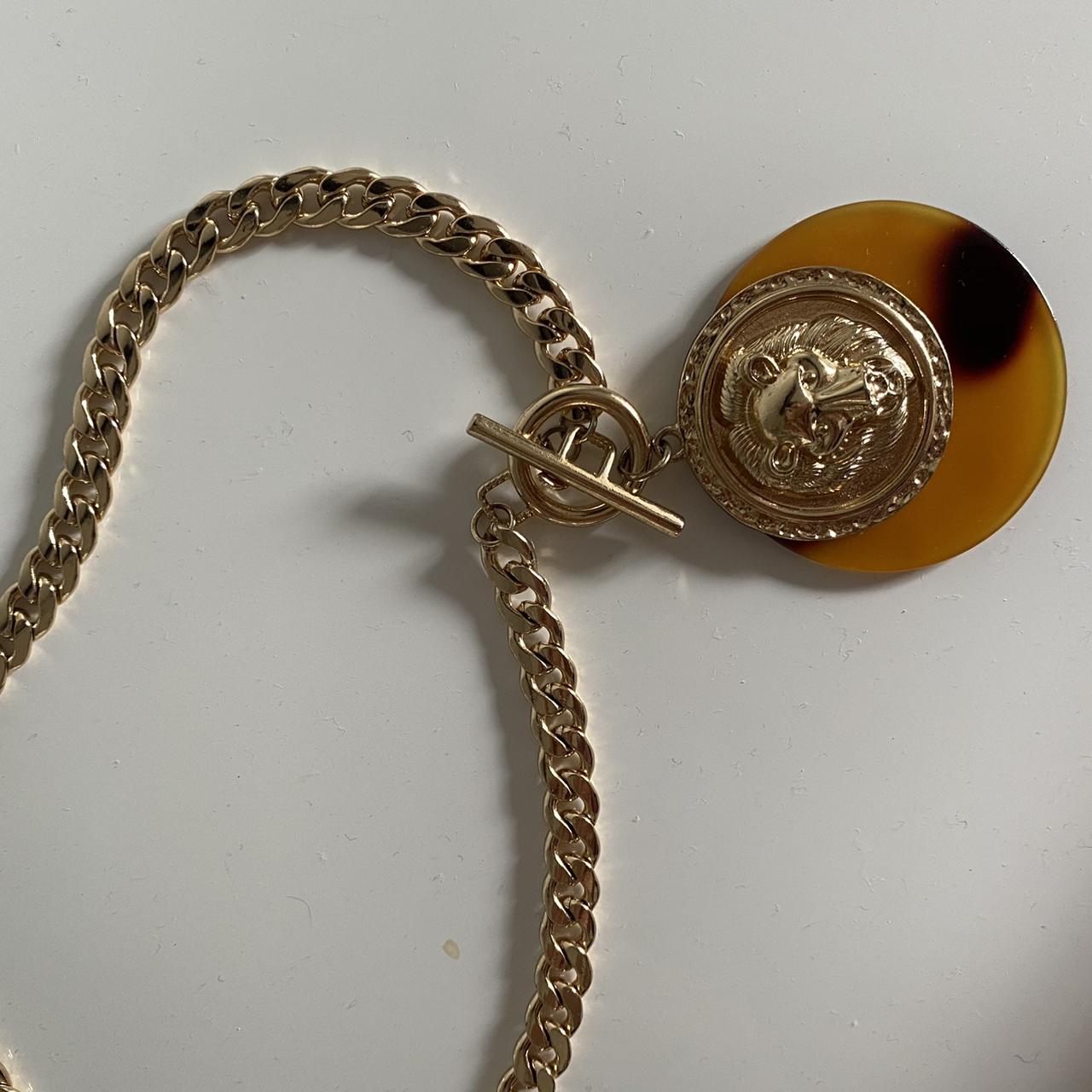 Gold lion chain necklace never worn and in perfect... - Depop