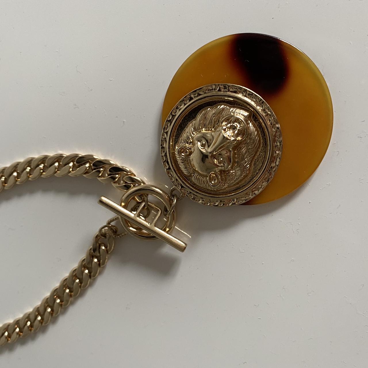 Gold lion chain necklace never worn and in perfect... - Depop