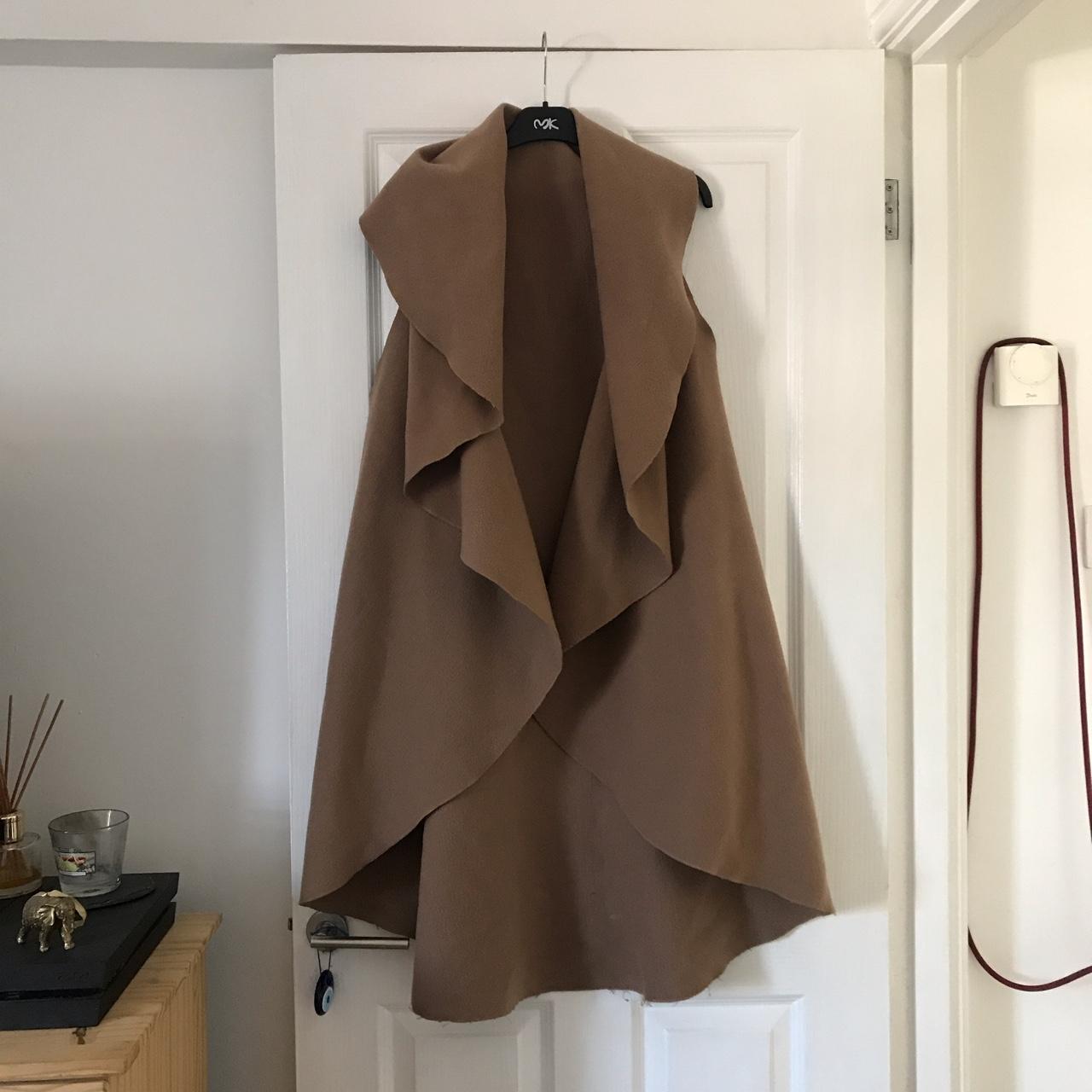 Waterfall sleeveless tan coat Kind of a wool... - Depop