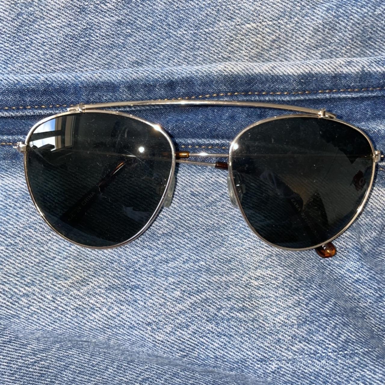 gold and black sunglasses, from urban outfitters.... - Depop