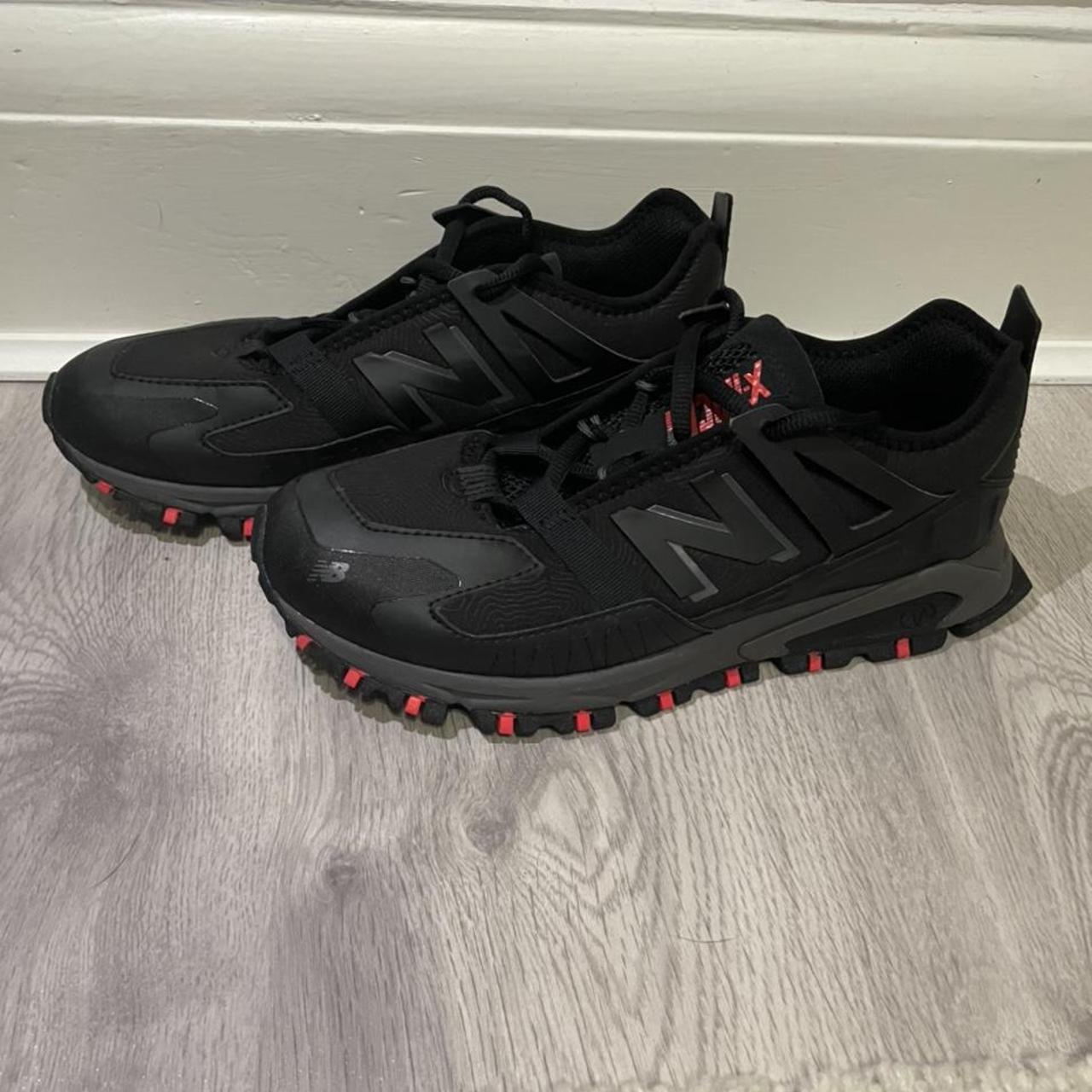 Black and red new balance trainers. Hardly been worn... - Depop