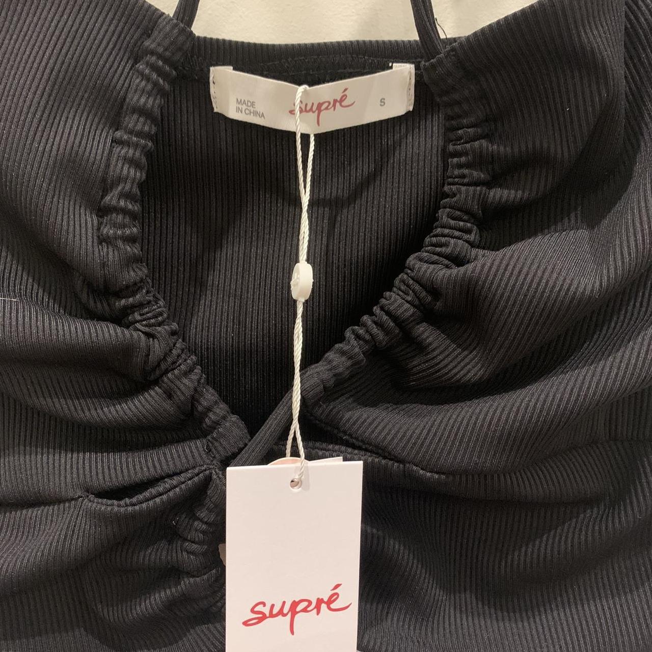 Supre black halter top with cute front cut out... - Depop