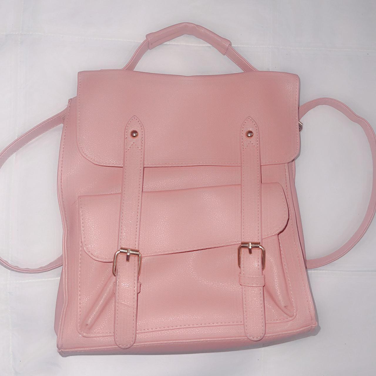 Typo pink mini backpack :) it can fit a iPhone XS... - Depop