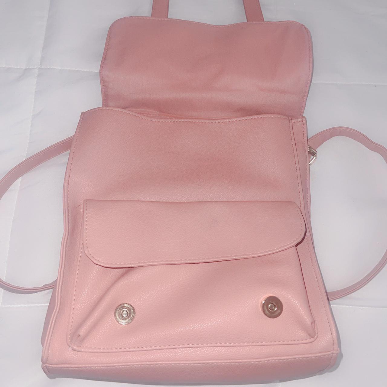 Typo pink mini backpack :) it can fit a iPhone XS... - Depop
