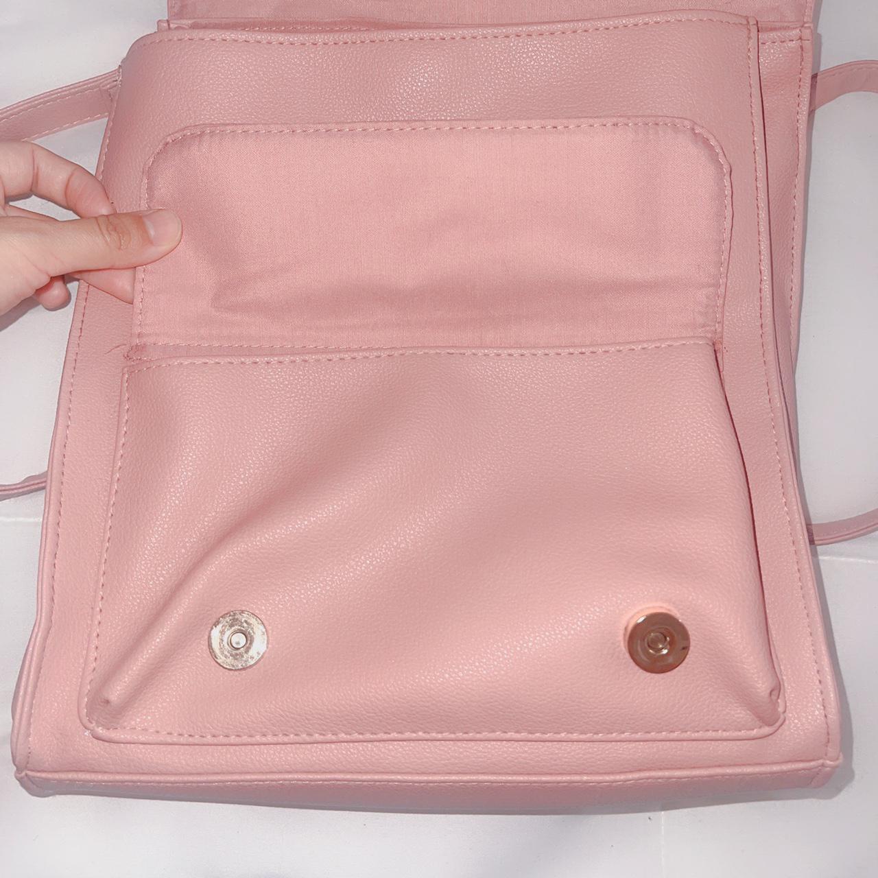 Typo pink mini backpack :) it can fit a iPhone XS... - Depop