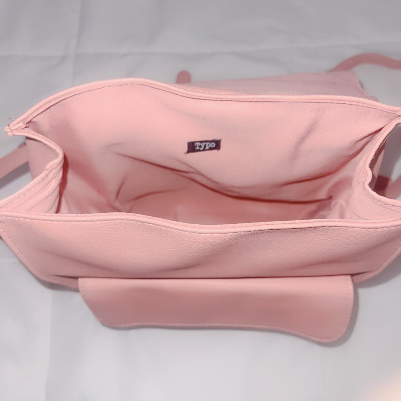Typo pink mini backpack :) it can fit a iPhone XS... - Depop