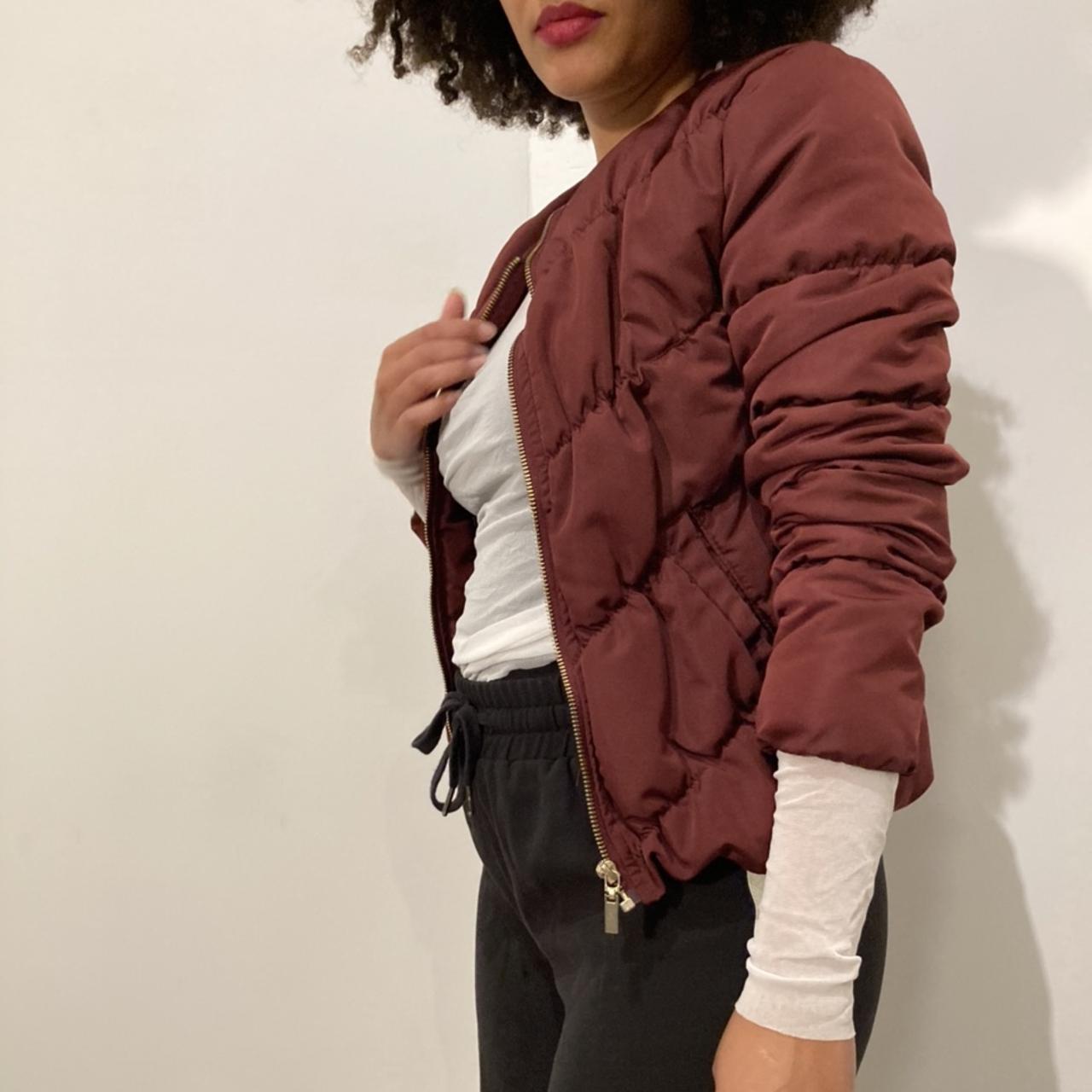 Cool burgundy puffer jacket with gold zipper. Size... - Depop