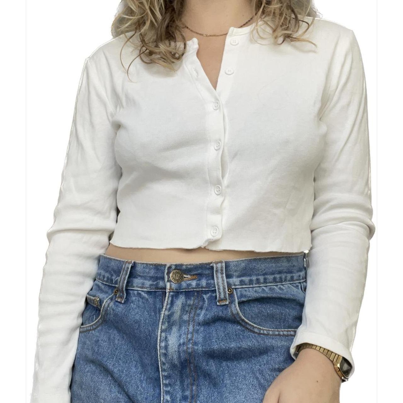 Cute white button up sweater. Hits right below the... - Depop