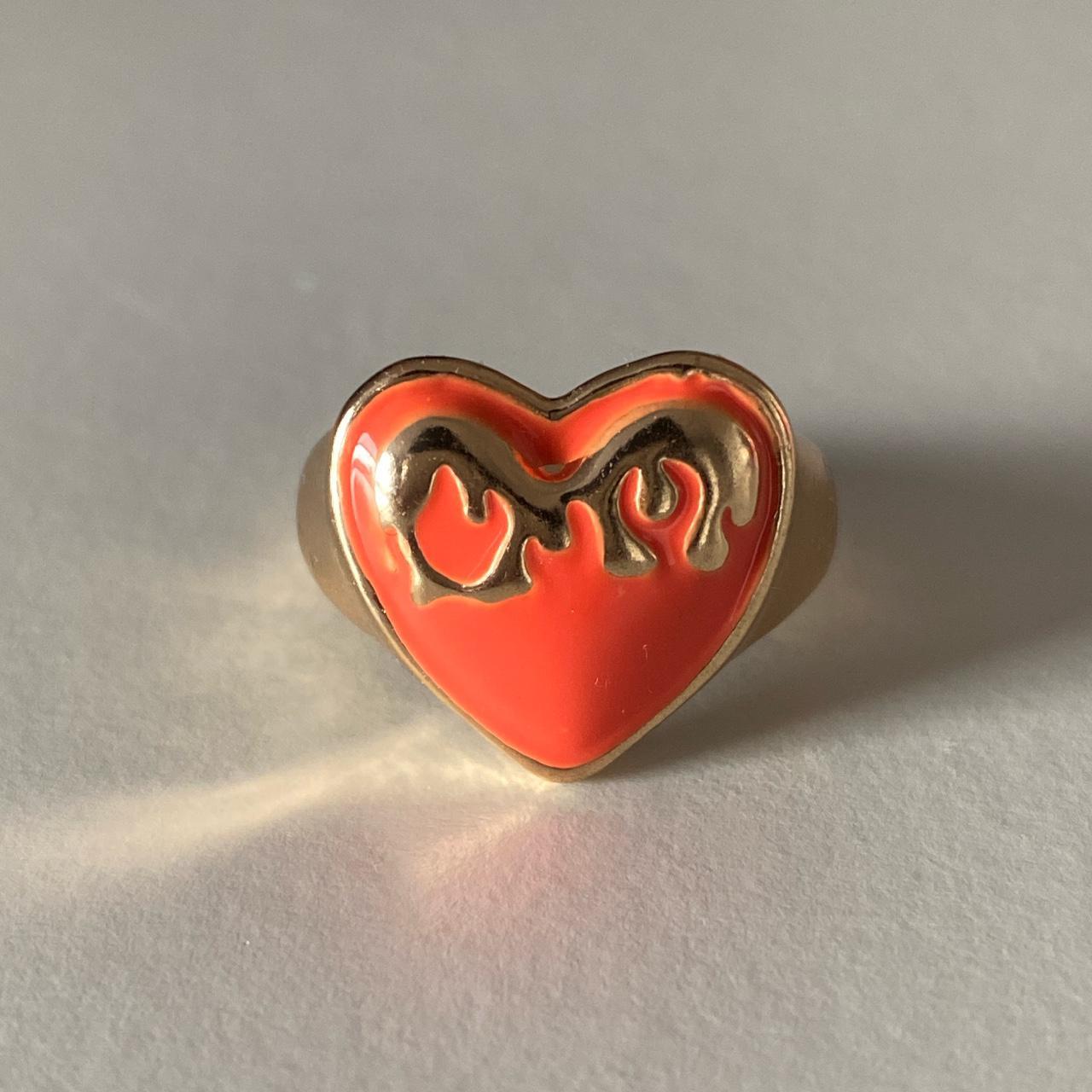 Stunning Gold and orange toned burning heart chunky... - Depop