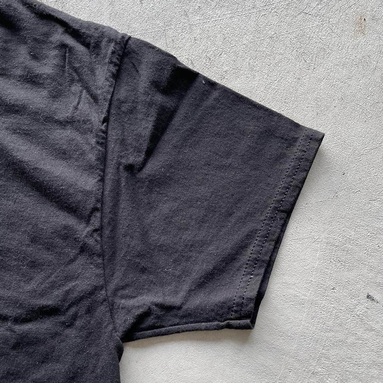 Clean blank black tee. Tagged a M and measures at... - Depop