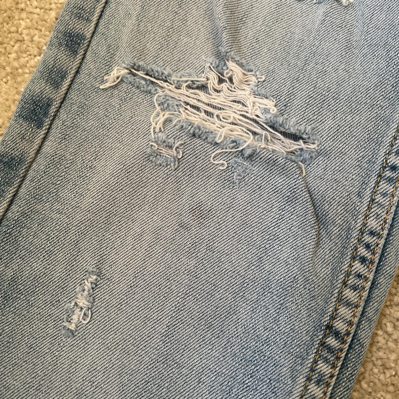 Topshop bleached and ripped jeans W26L30 Slight... - Depop