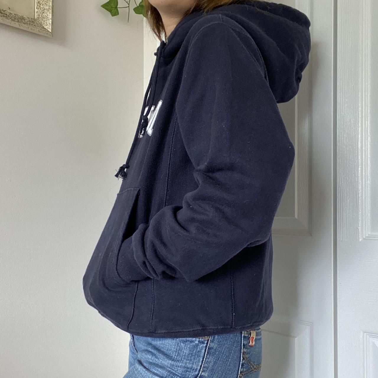 Iconic Moma exclusive champion hoodie in navy blue... - Depop