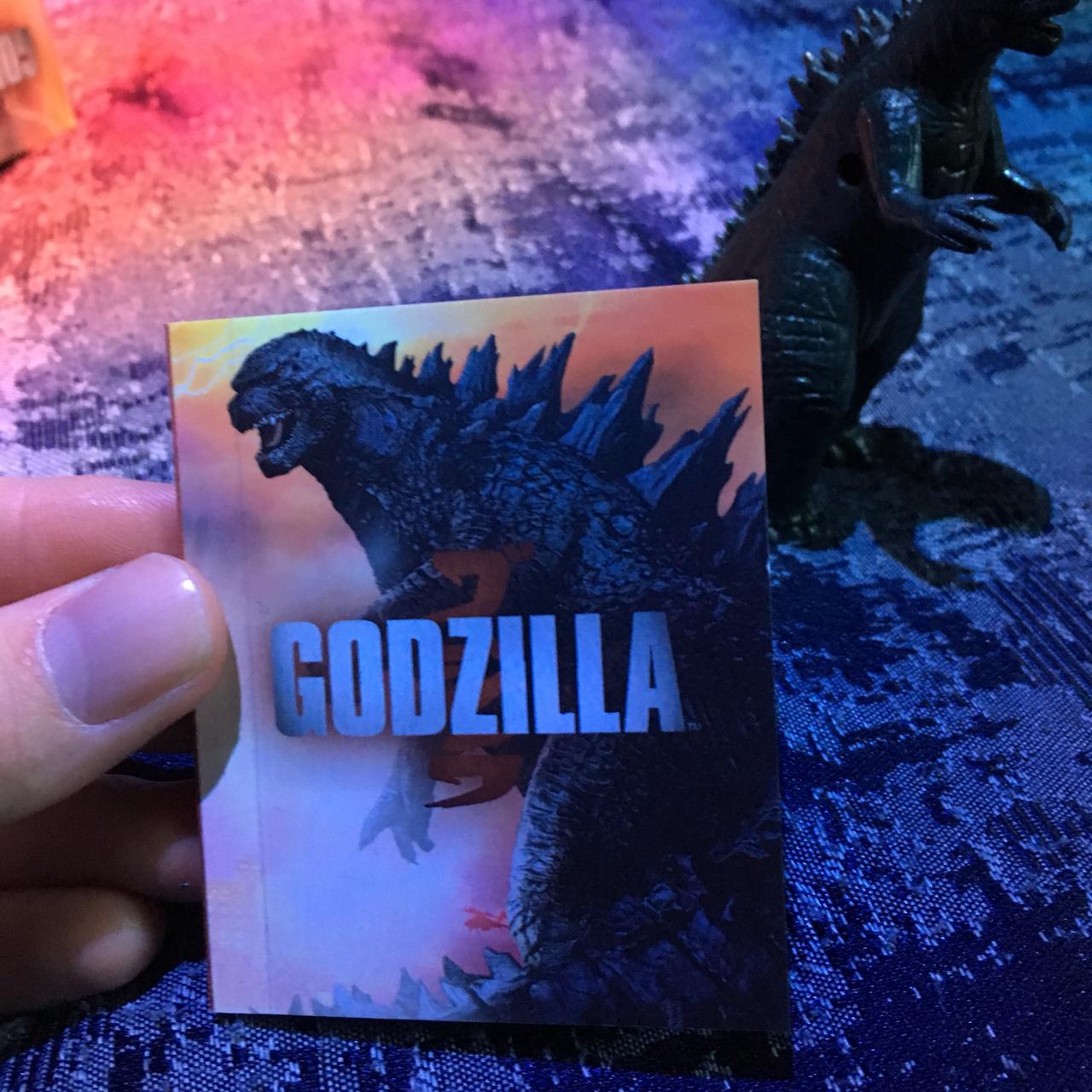 Godzilla miniature with collectible sticker book and... - Depop