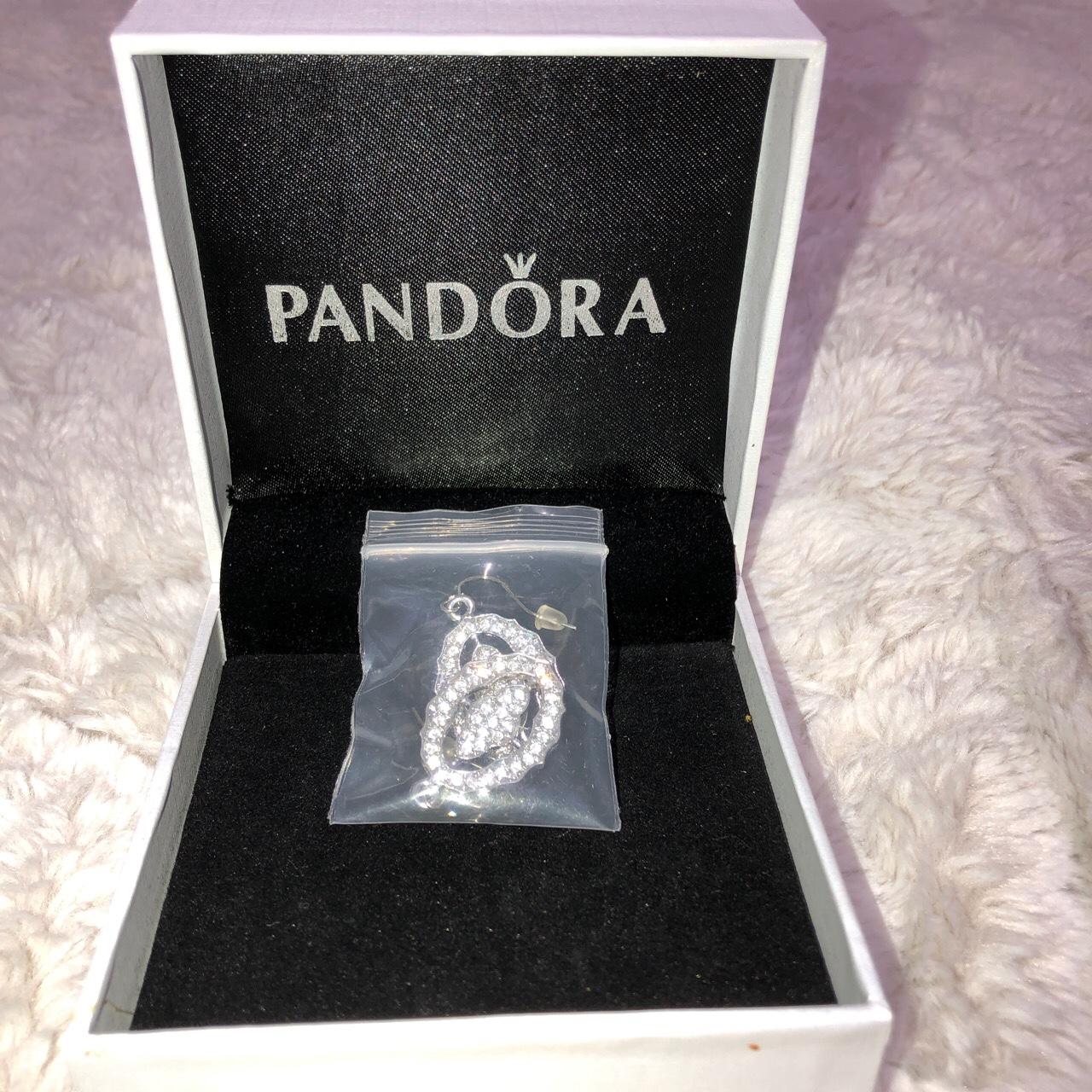 This is a Pandora Dangle earrings. It has not be... - Depop