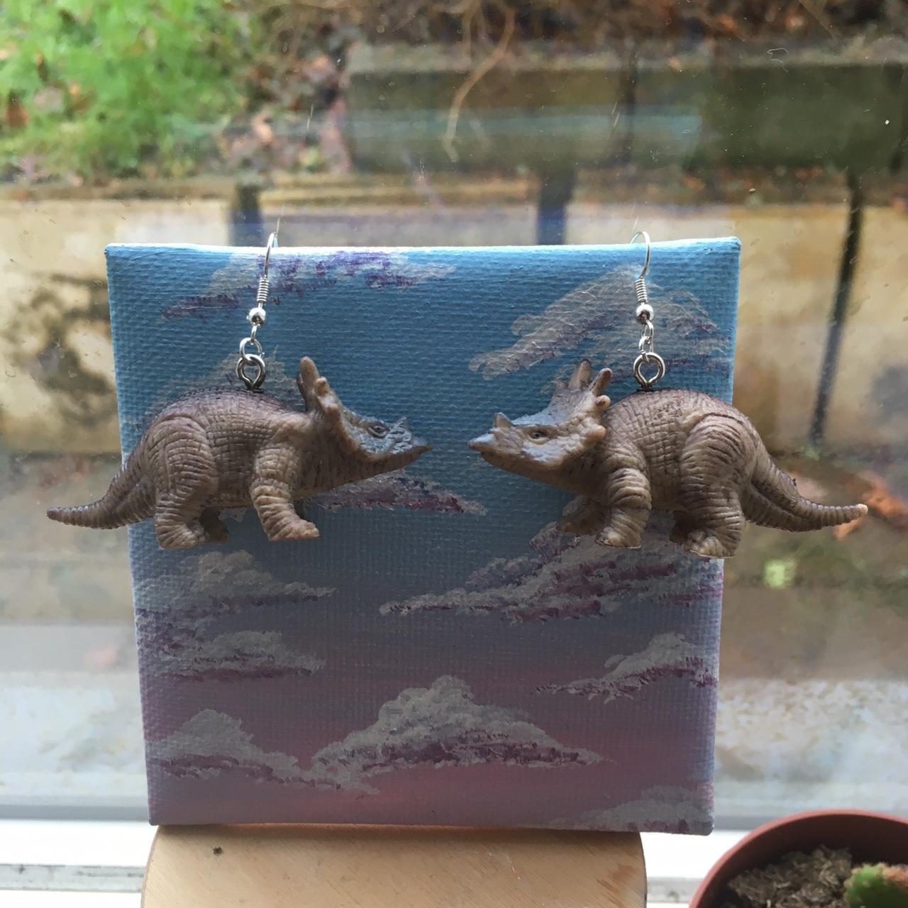 Dino earrings matching set See more dinosaur... - Depop