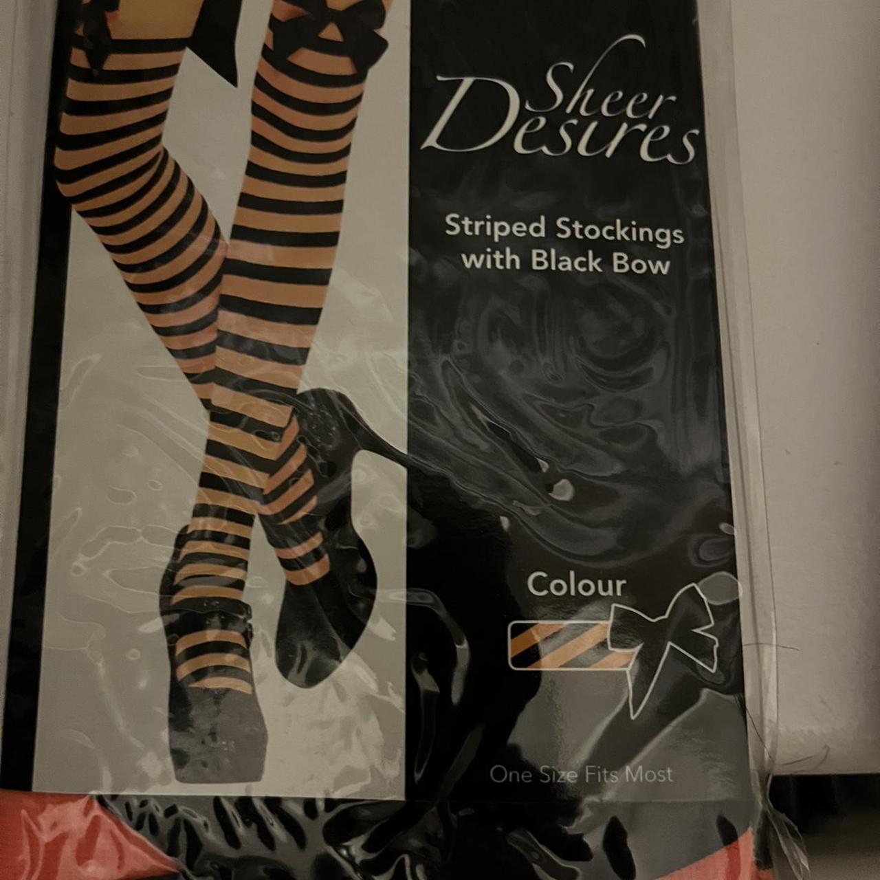 Striped orange and black stockings with black bow.... | Depop