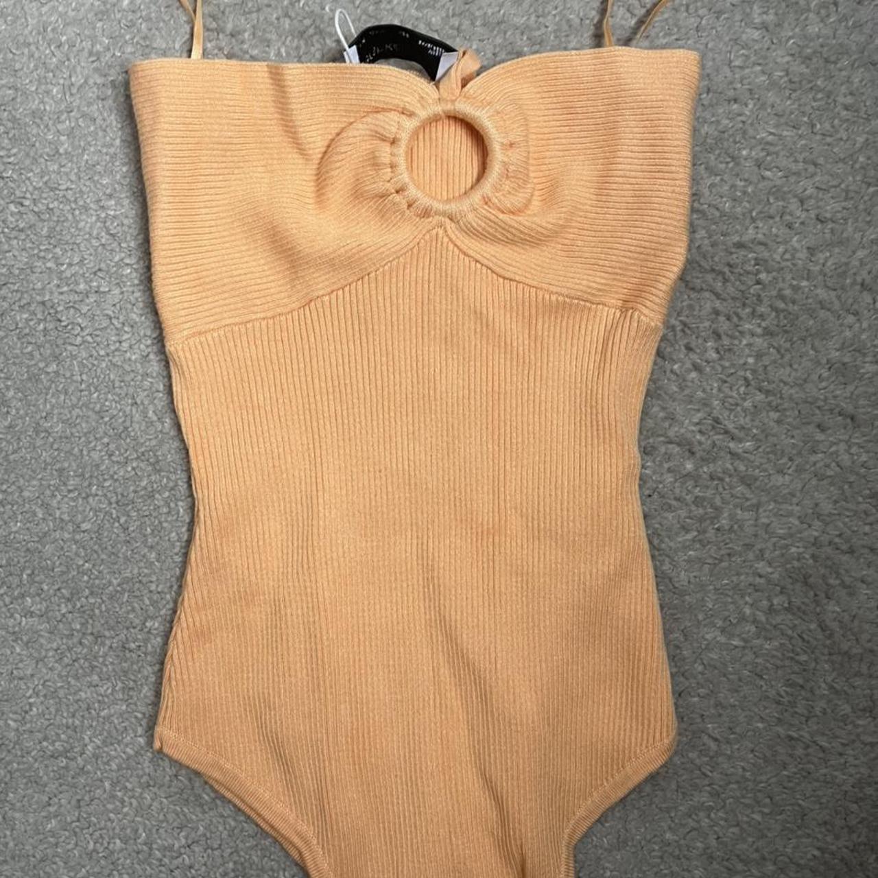 Orange bodysuit never worn tags still on would fit... - Depop
