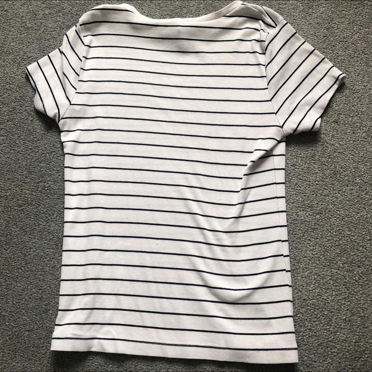 White ribbed tshirt with black stripes, fits pretty... - Depop