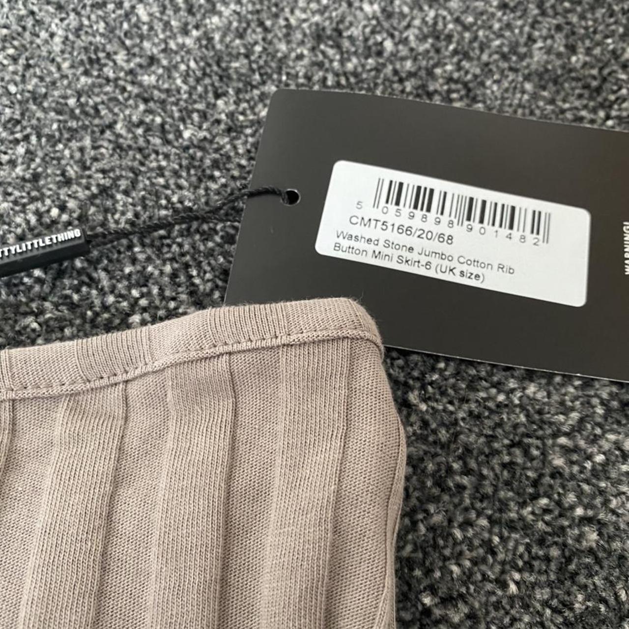 washed stone jumbo cotton rib button mini... - Depop