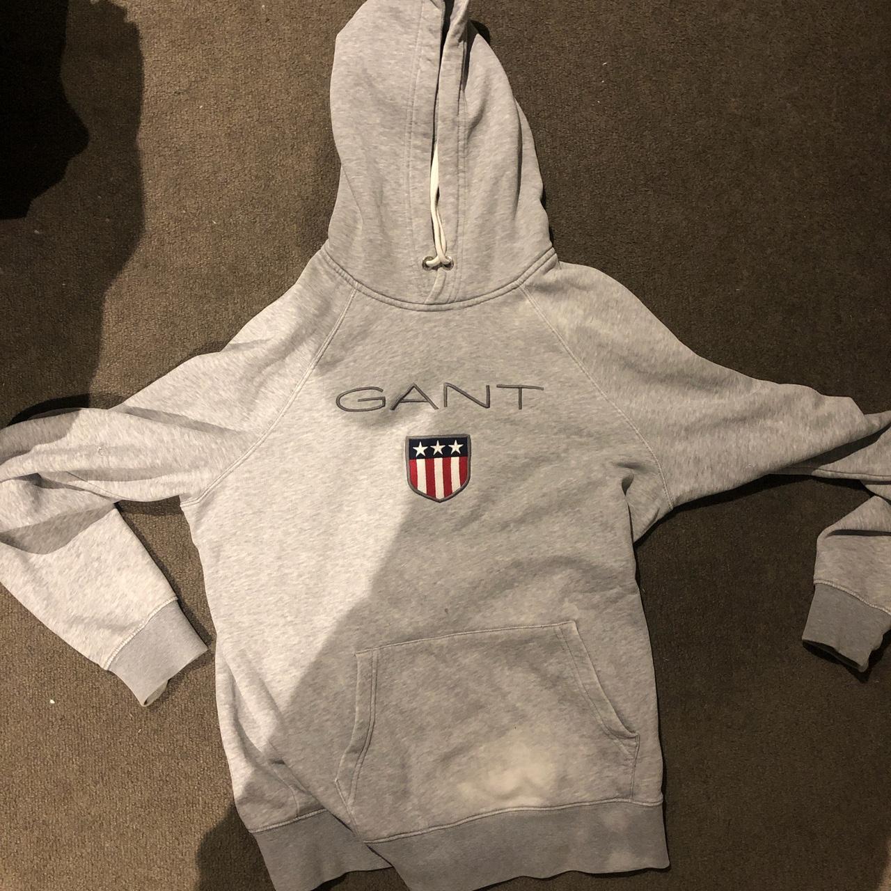 Grey gant hoodie Size medium Small bleach stain... - Depop