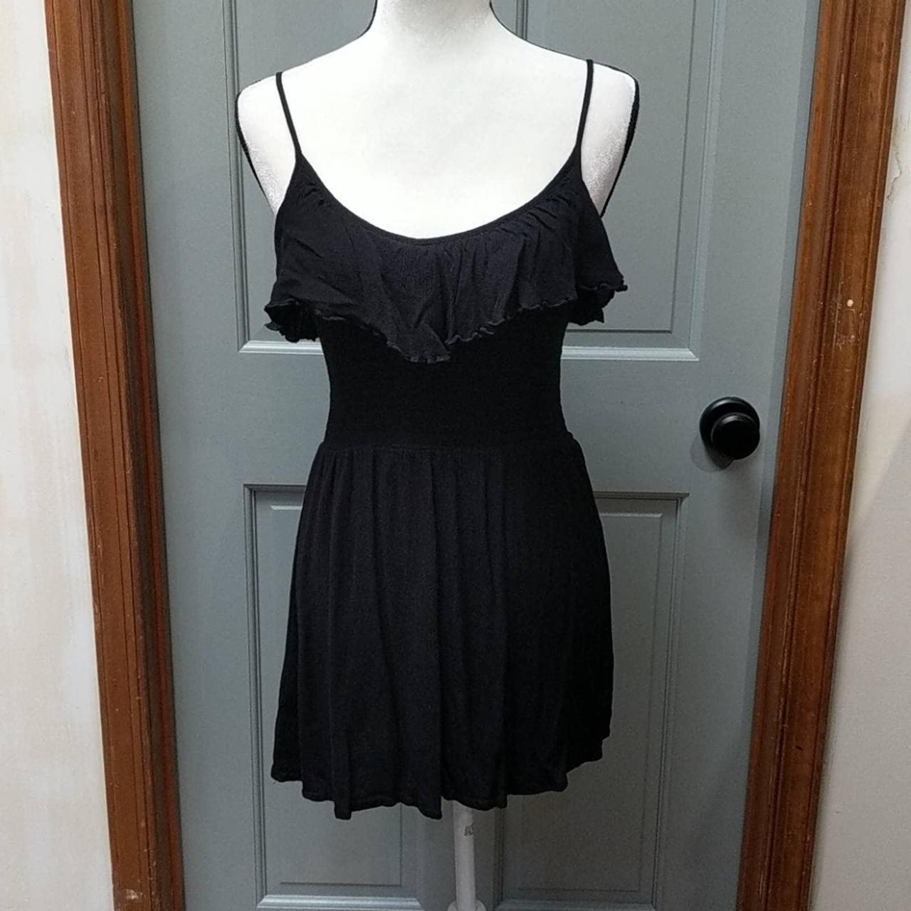 This is a barely worn black frilly/ruffled summer... - Depop