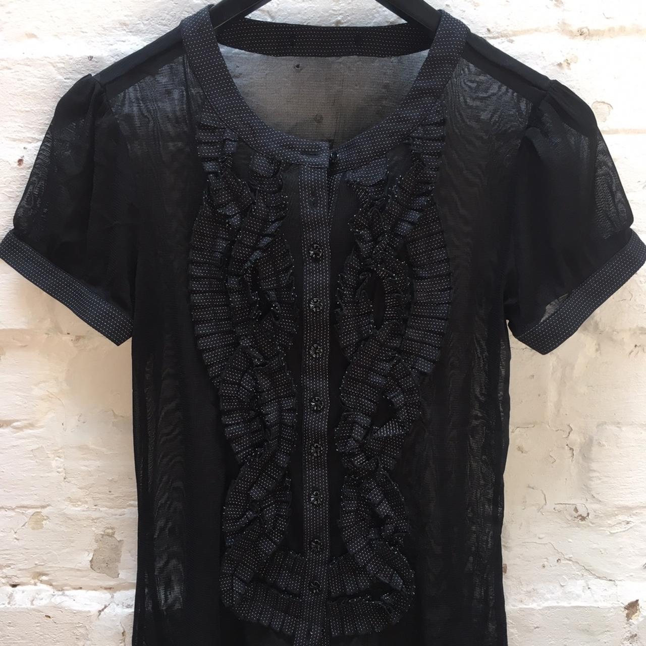 Transparent black button up top. Details at front... - Depop
